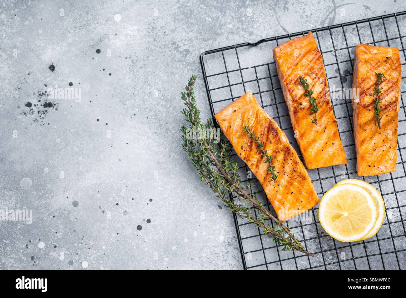 Grilled salmon fillet steak, roast fish on a rack. grey background. top ...