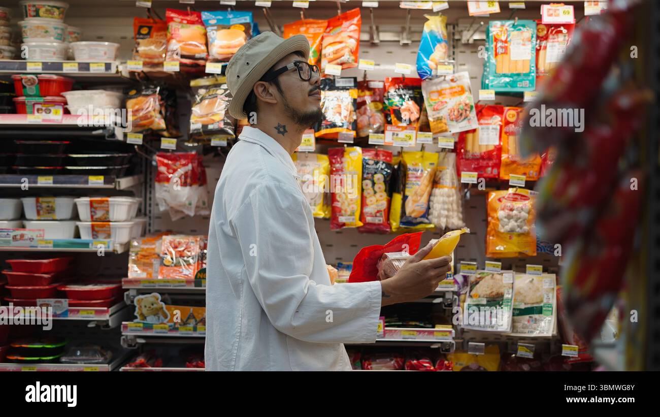 Professional examining packaged food products hi-res stock photography ...