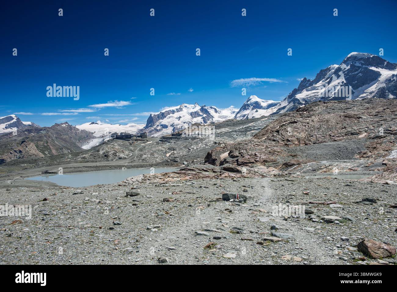 A breathtaking view of the Swiss Alps, featuring snow-capped mountains ...