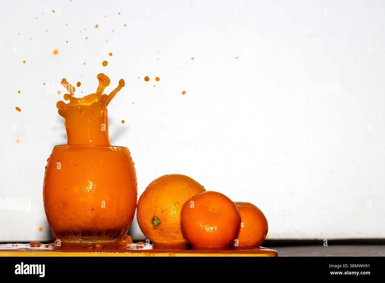 Closeup Image of Orange Juice Splash with Fresh Oranges in White ...