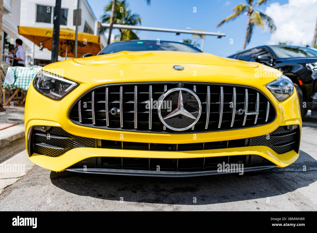 Miami, Florida, USA - April 19, 2025: Yellow car, front view. Mercedes ...
