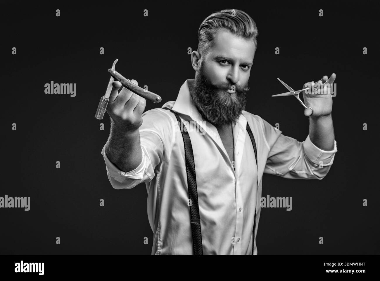 Retro hairdresser holding razor and scissors isolated on black. Haircut ...