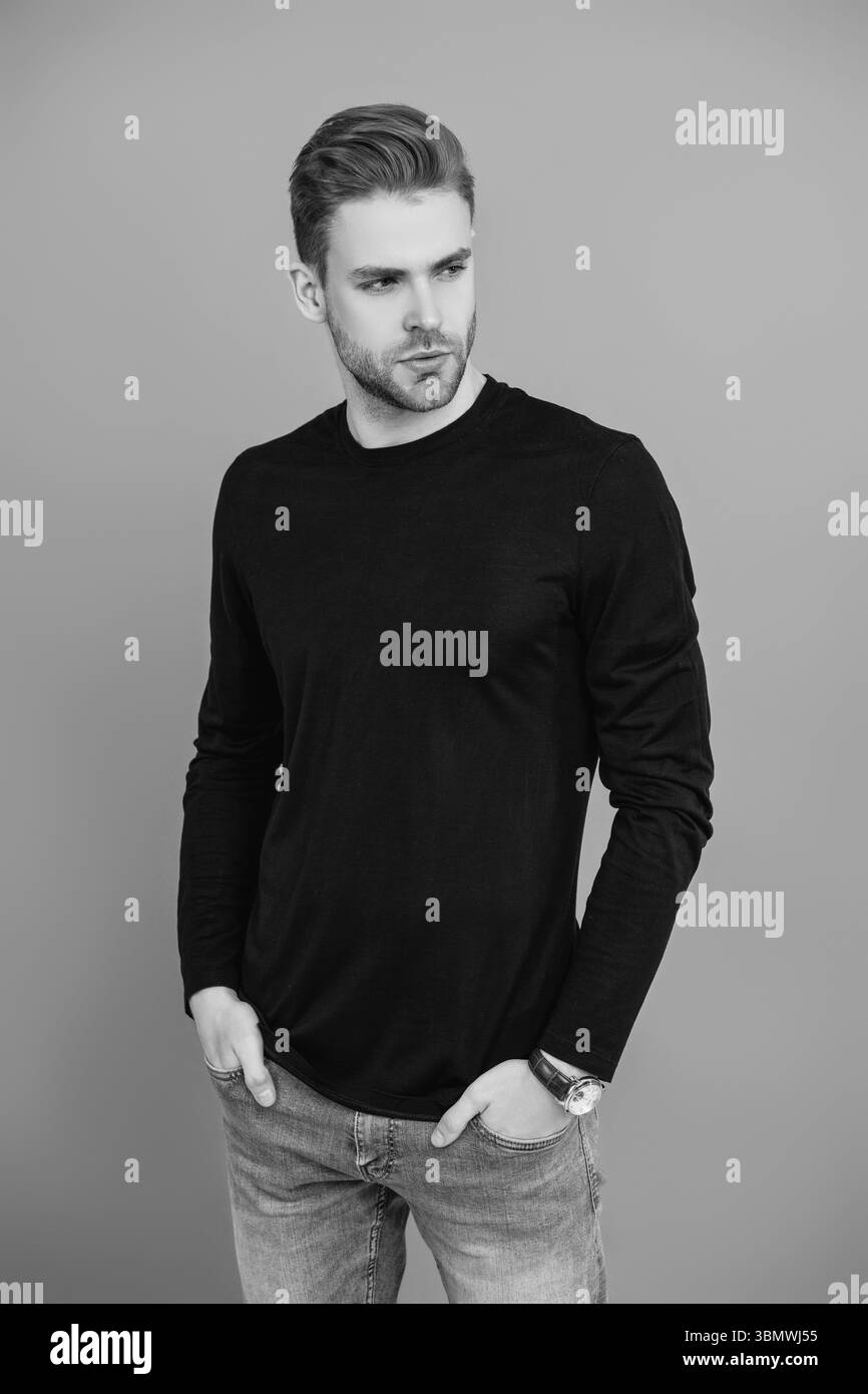 Unshaven man isolated on grey. Portrait of man with stylish haircut. Millennial charismatic ...