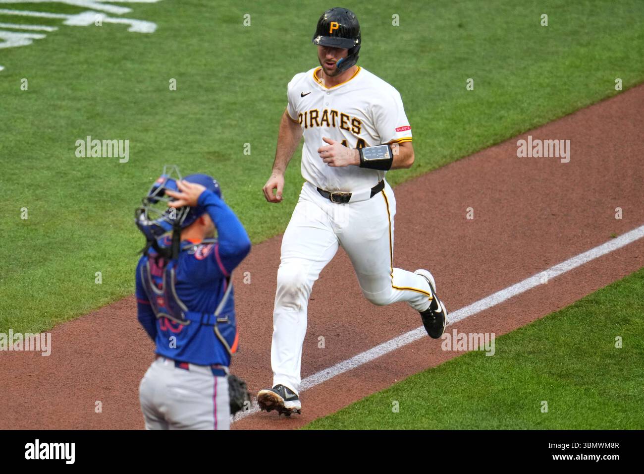 Pittsburgh Pirates' Joey Bart, right, scores on a single by Ke'Bryan ...