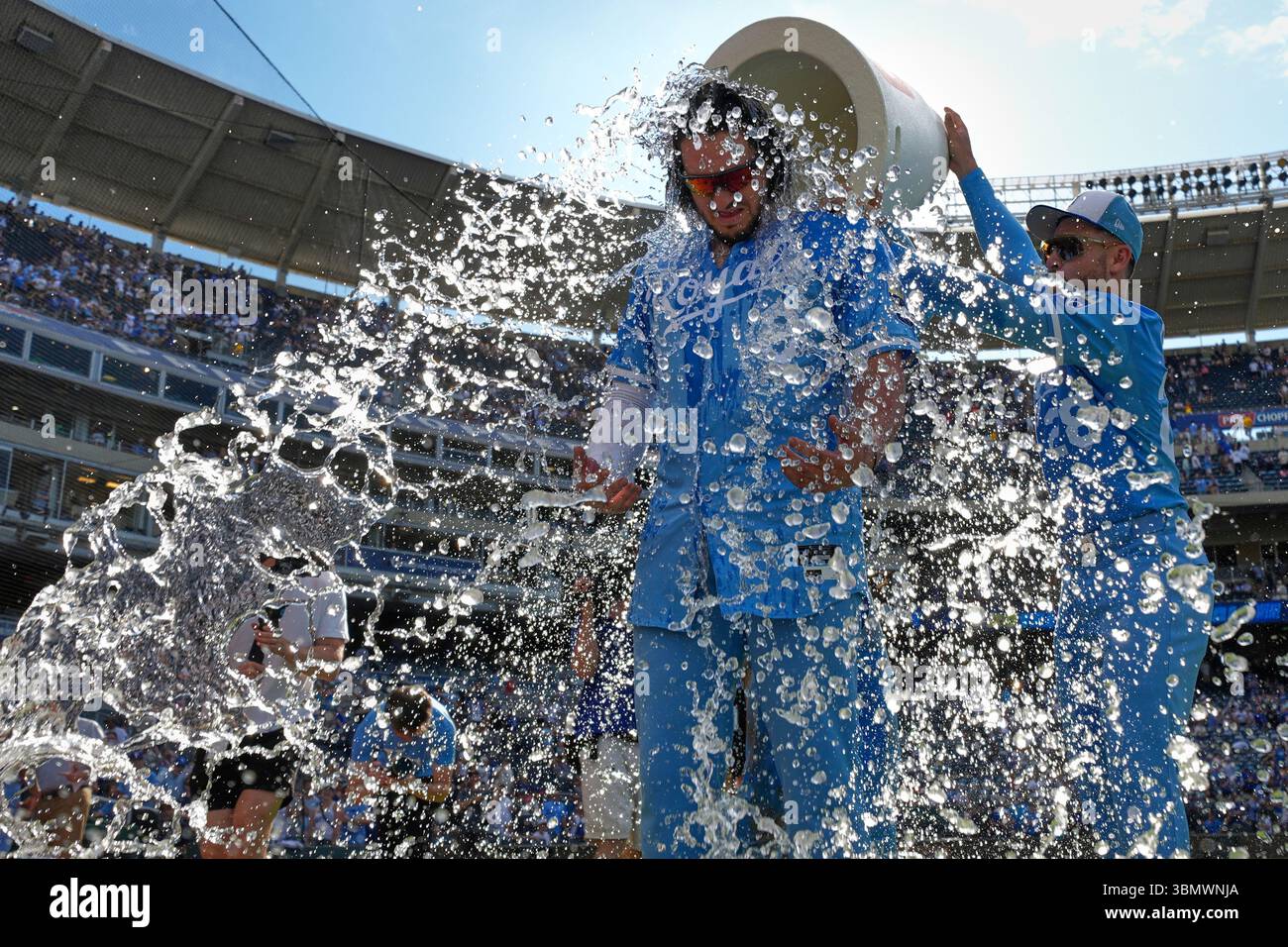 Kansas City Royals' Vinnie Pasquantino is doused by Kyle Isbel (28 ...