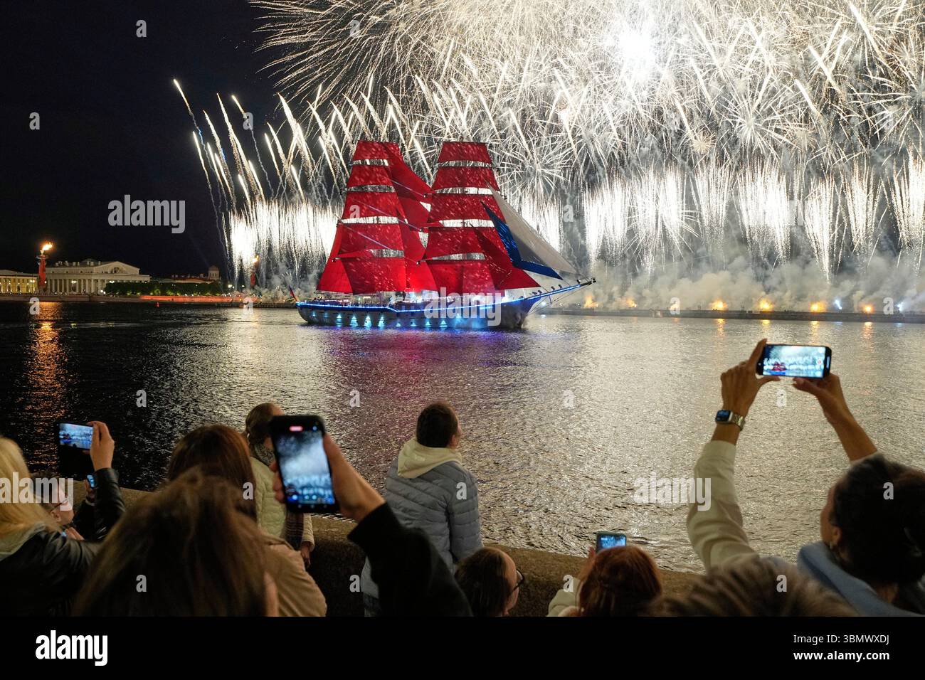 A brig with scarlet sails floats on the Neva River during the Scarlet ...