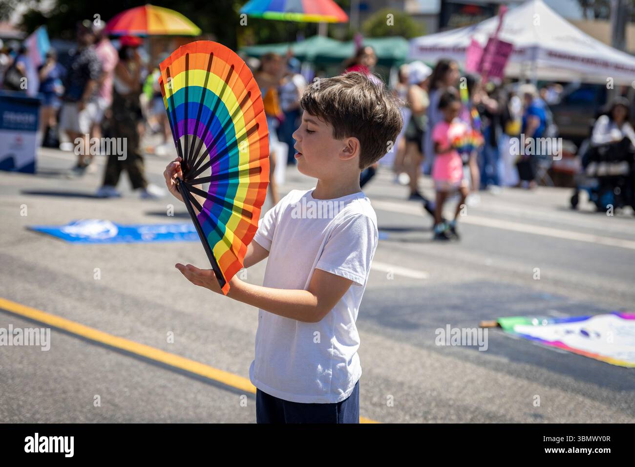 Van Nuys, California, USA. 28th June, 2025. A boy plays with a pride ...