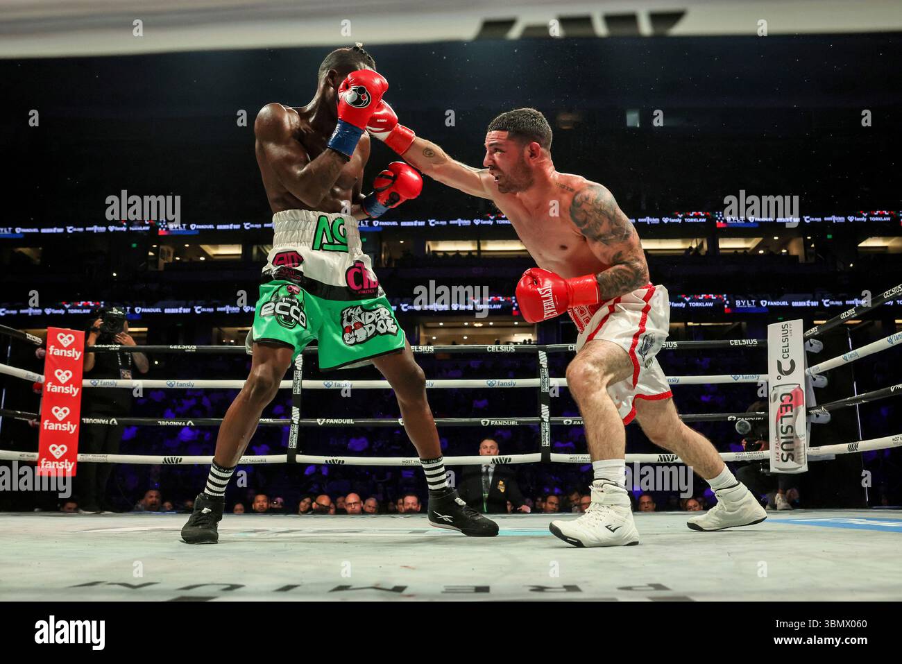 Julian Rodriguez, right, throws a punch at Avious Griffin during their ...