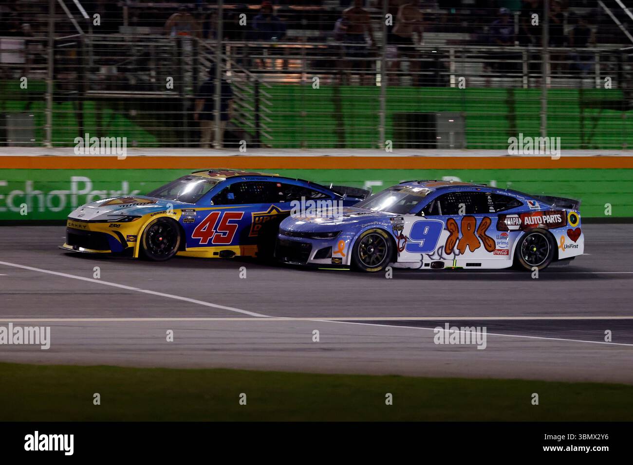 Tyler Reddick (45) races Chase Elliott (9) to the line to win Stage Two ...