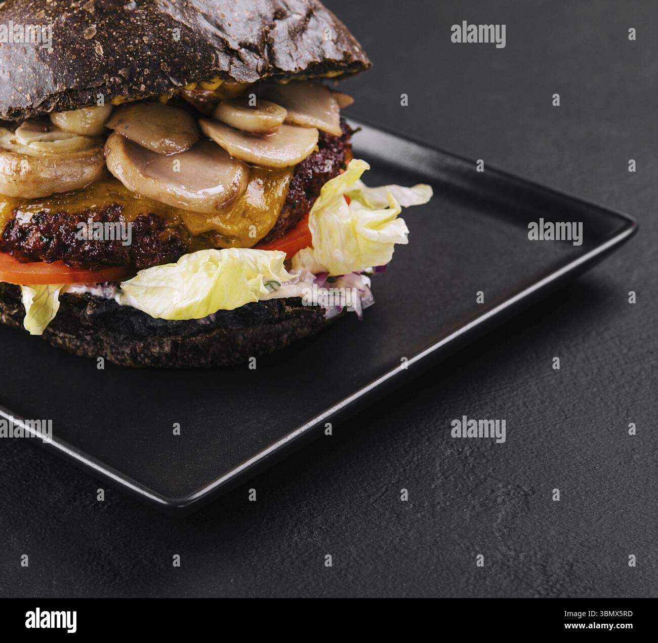 food still-life, Black burger with beef and mushrooms Stock Photo - Alamy