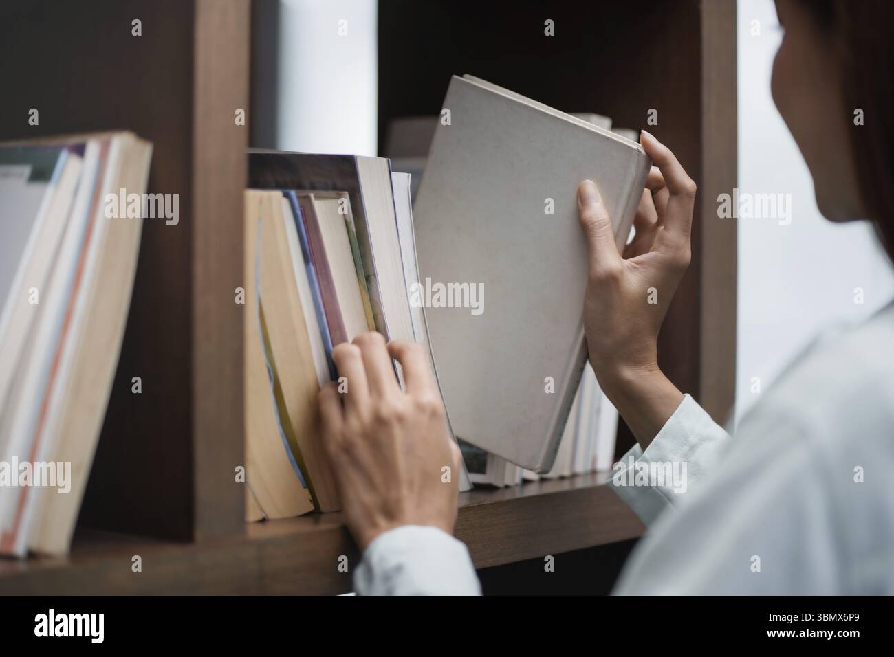 Asian student girl High School Researching Book In Library. University ...