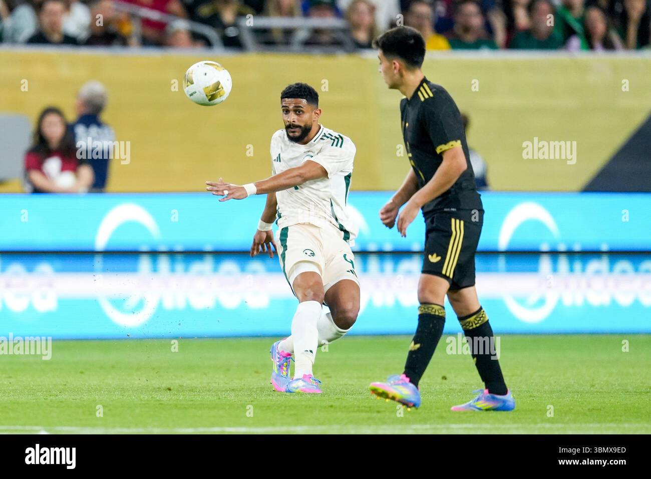 Saudi Arabia defender Abdulelah Alamri (4) kicks the ball past Mexico ...