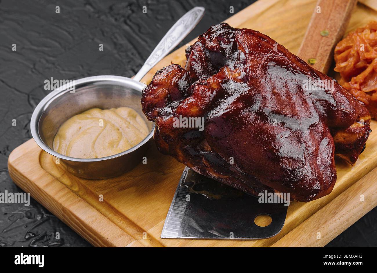 food still-life, Tasty baked pork knuckle on wooden board Stock Photo ...