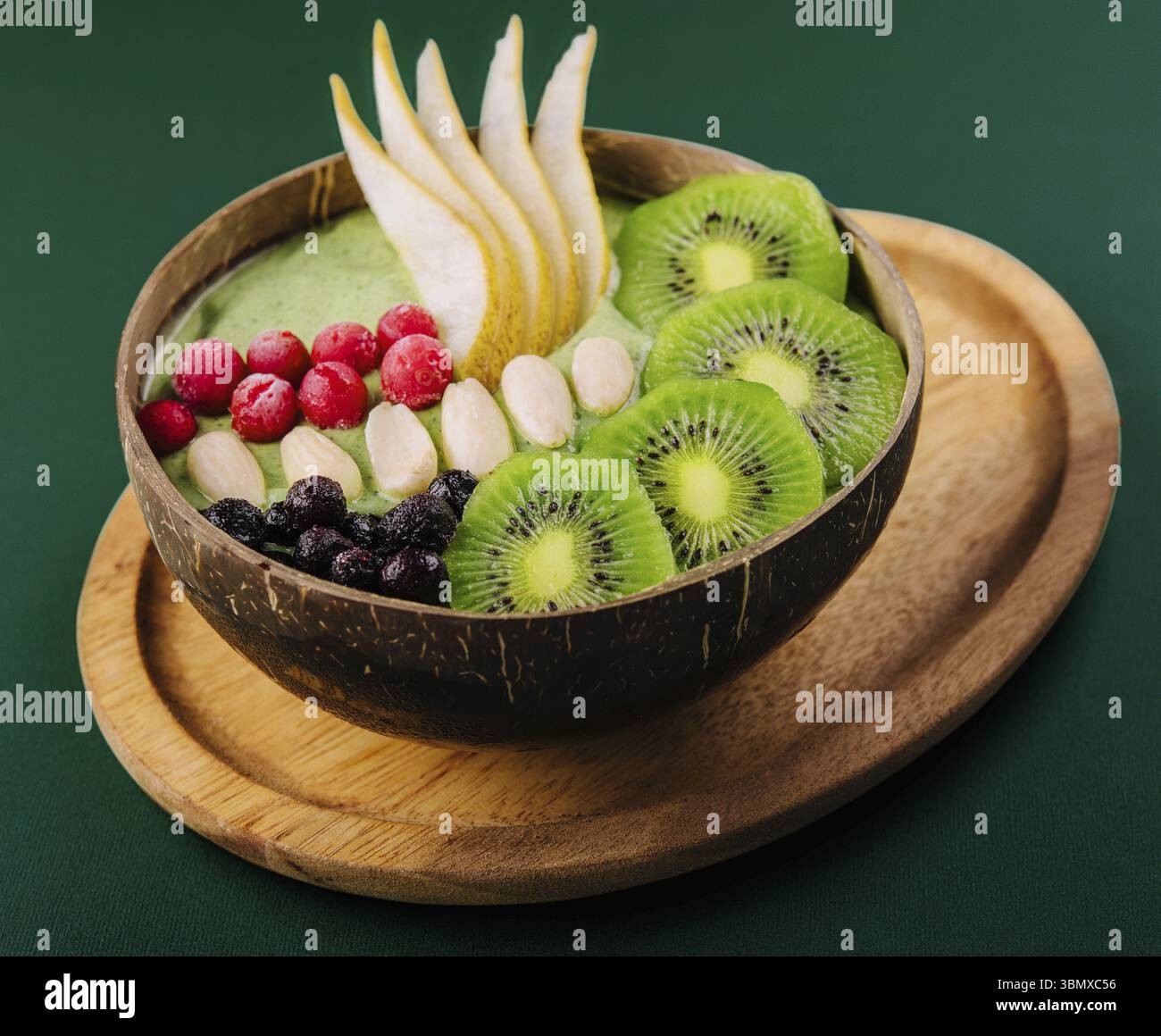 food still-life, Green smoothie bowl with nuts, kiwi, pear, berry and ...