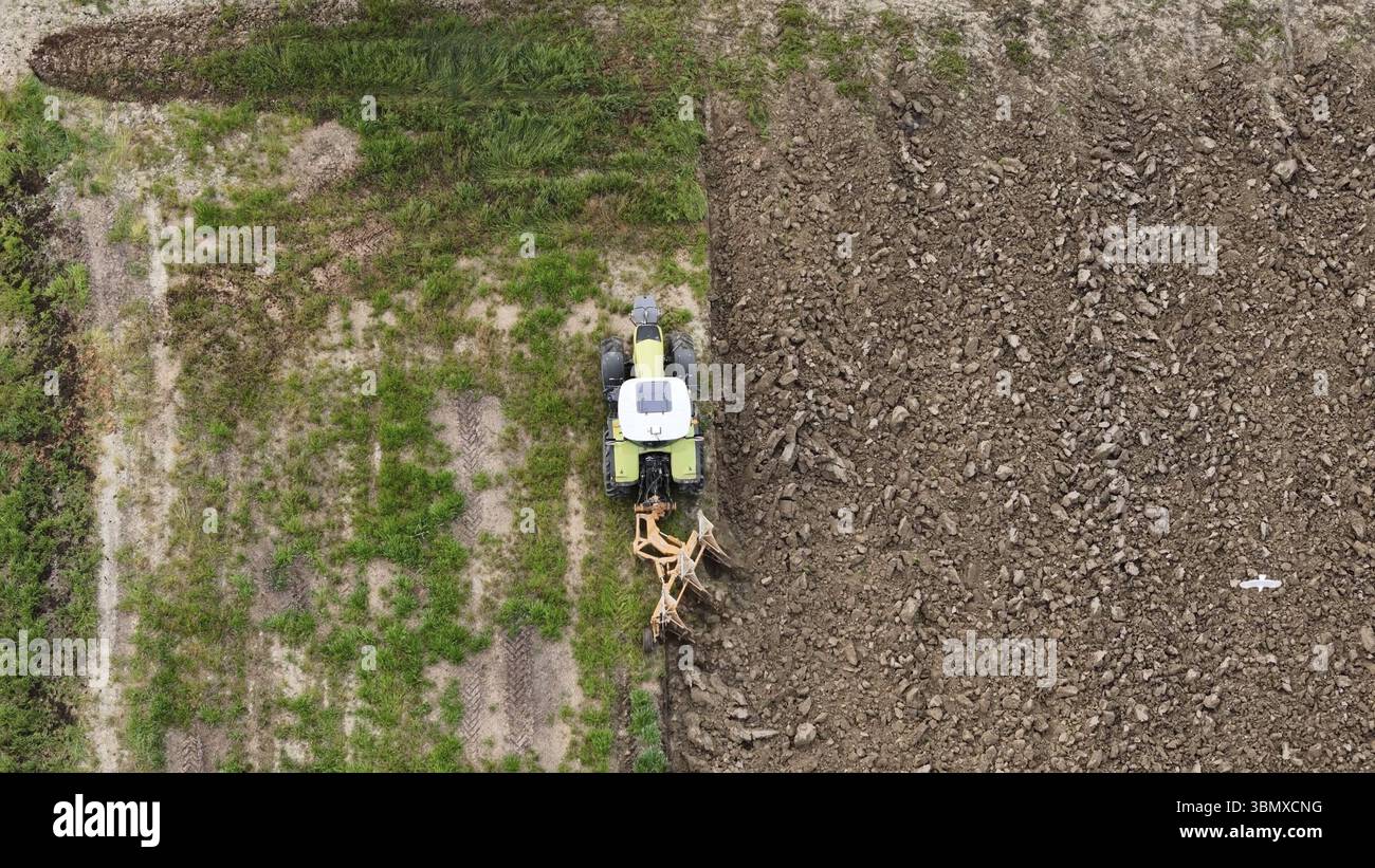 Aerial View of Tractor Plowing a Field Preparing the Soil for Planting ...