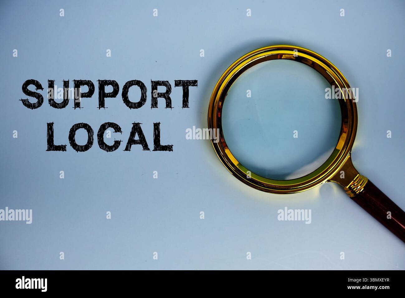 Support Local text with magnifying glass on blue background Stock Photo ...
