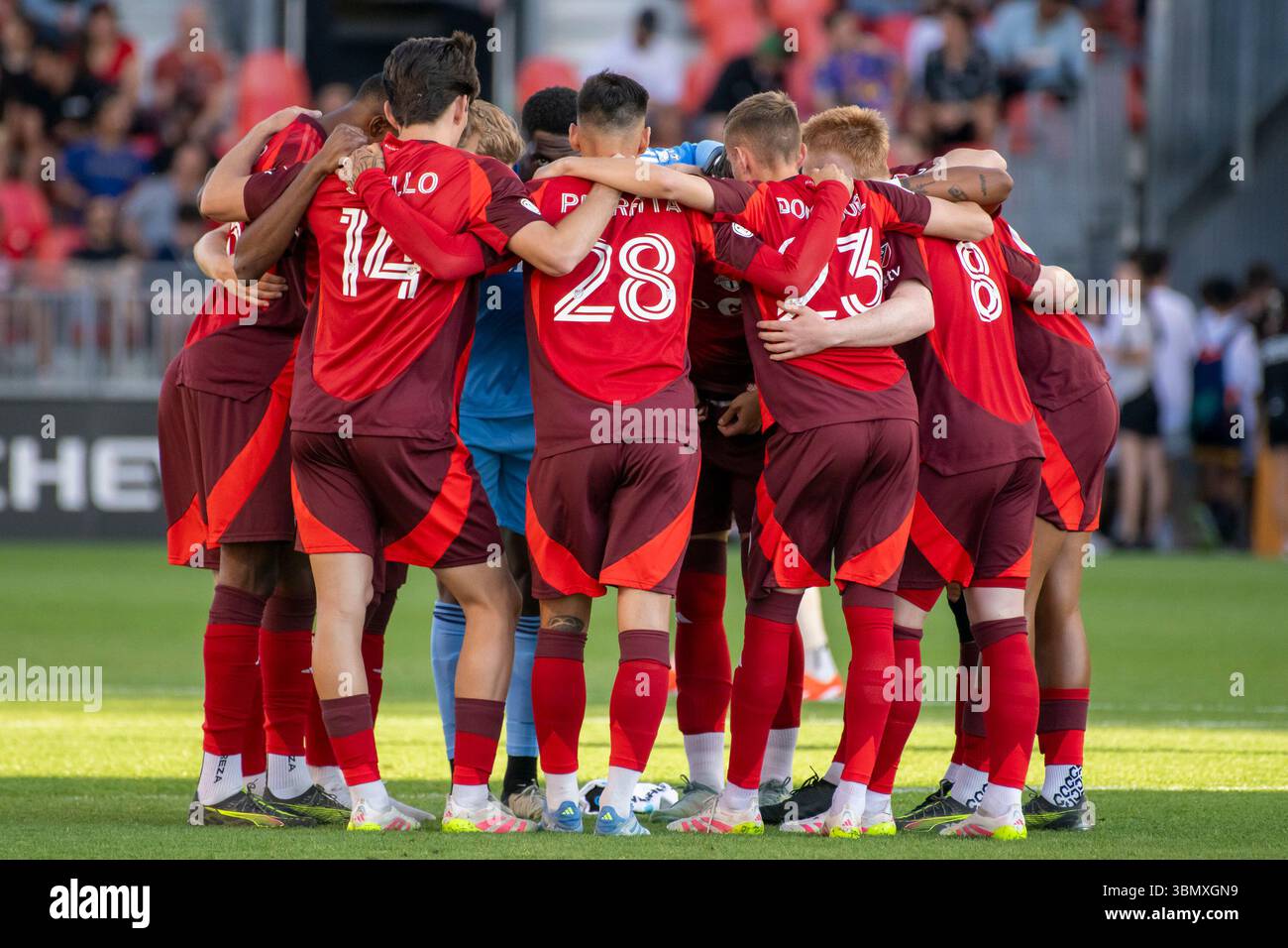 Toronto, Ontario, Canada. 28th June, 2025. Toronto FC players huddle ...