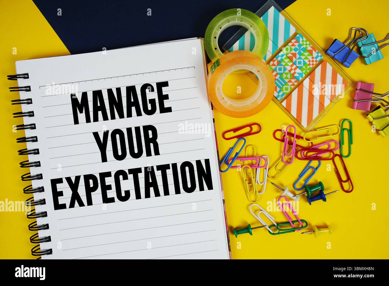 Manage Your Expectation text with stationery on yellow background Stock ...
