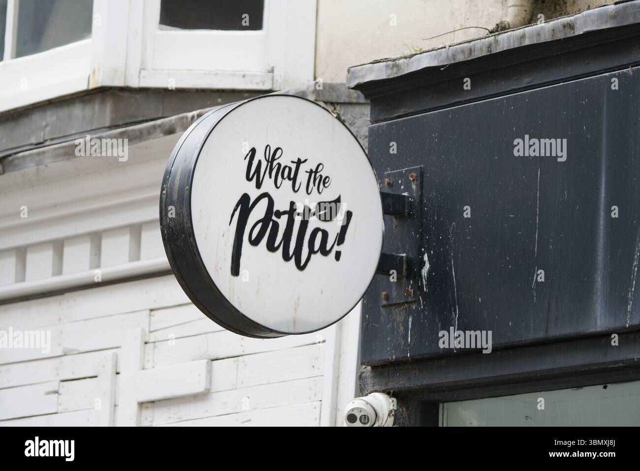 Round Signage Display with Bold Font for a Restaurant Exterior ...