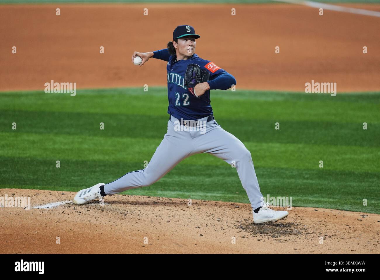 Seattle Mariners starting pitcher Bryan Woo winds up to deliver to the ...