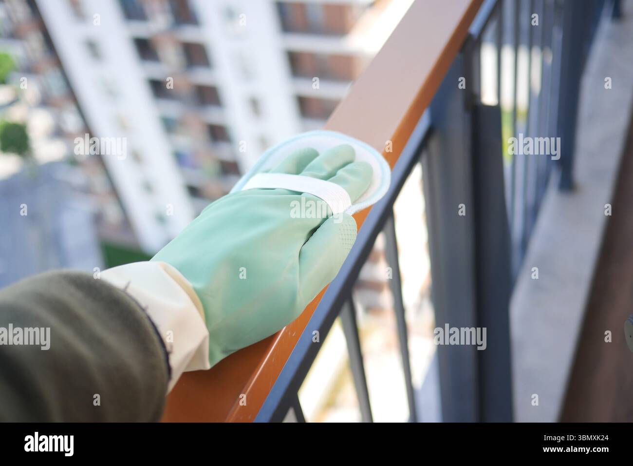 Person cleaning balcony railing care hi-res stock photography and ...