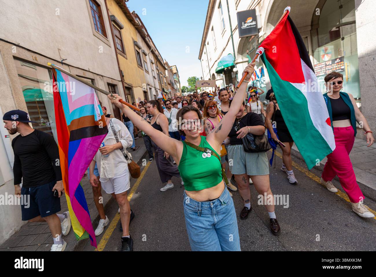 A Protesters carry Palestinian and LGBTQ+ pride flags during the 20th ...