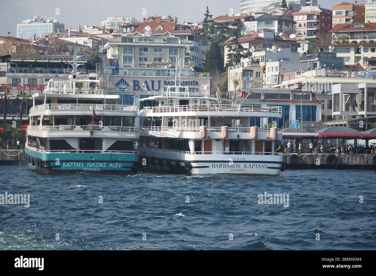 turkey istanbul 17 june 2025. Boats docked at a bustling waterfront in ...