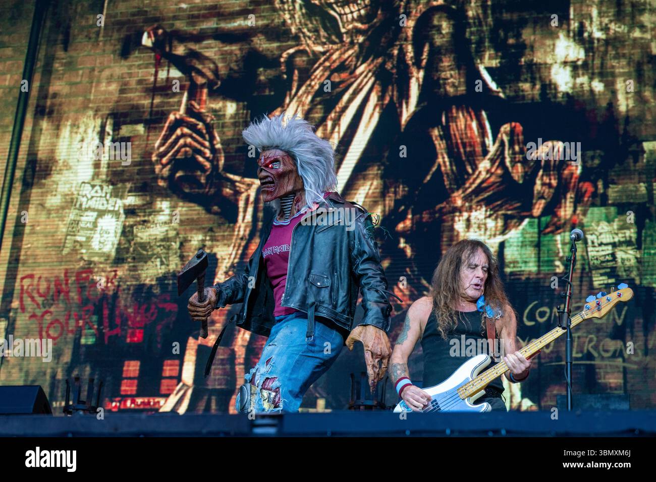 Steve Harris seen live on stage playing Bass with band Iron Maiden and ...