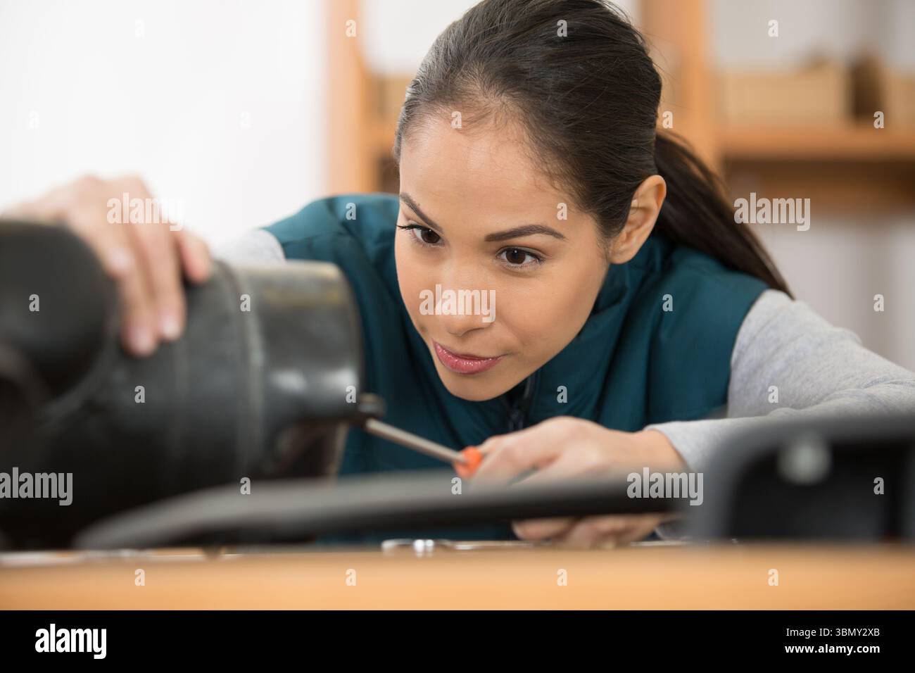 Young woman doing hard work hi-res stock photography and images - Alamy