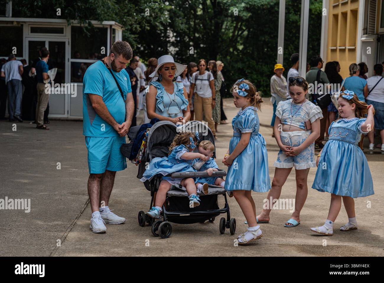 A family pray outside prayer hall at The Saint James Church complex in ...
