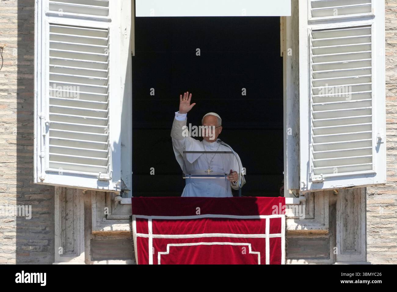 Pope Leo XIV appears at his studio's window to bless the faithful ...
