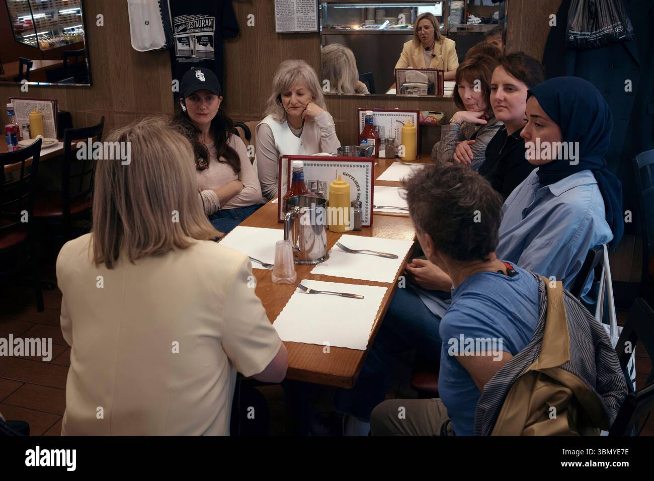 Frieda Vizel, left, sits at the table with participants during her ...