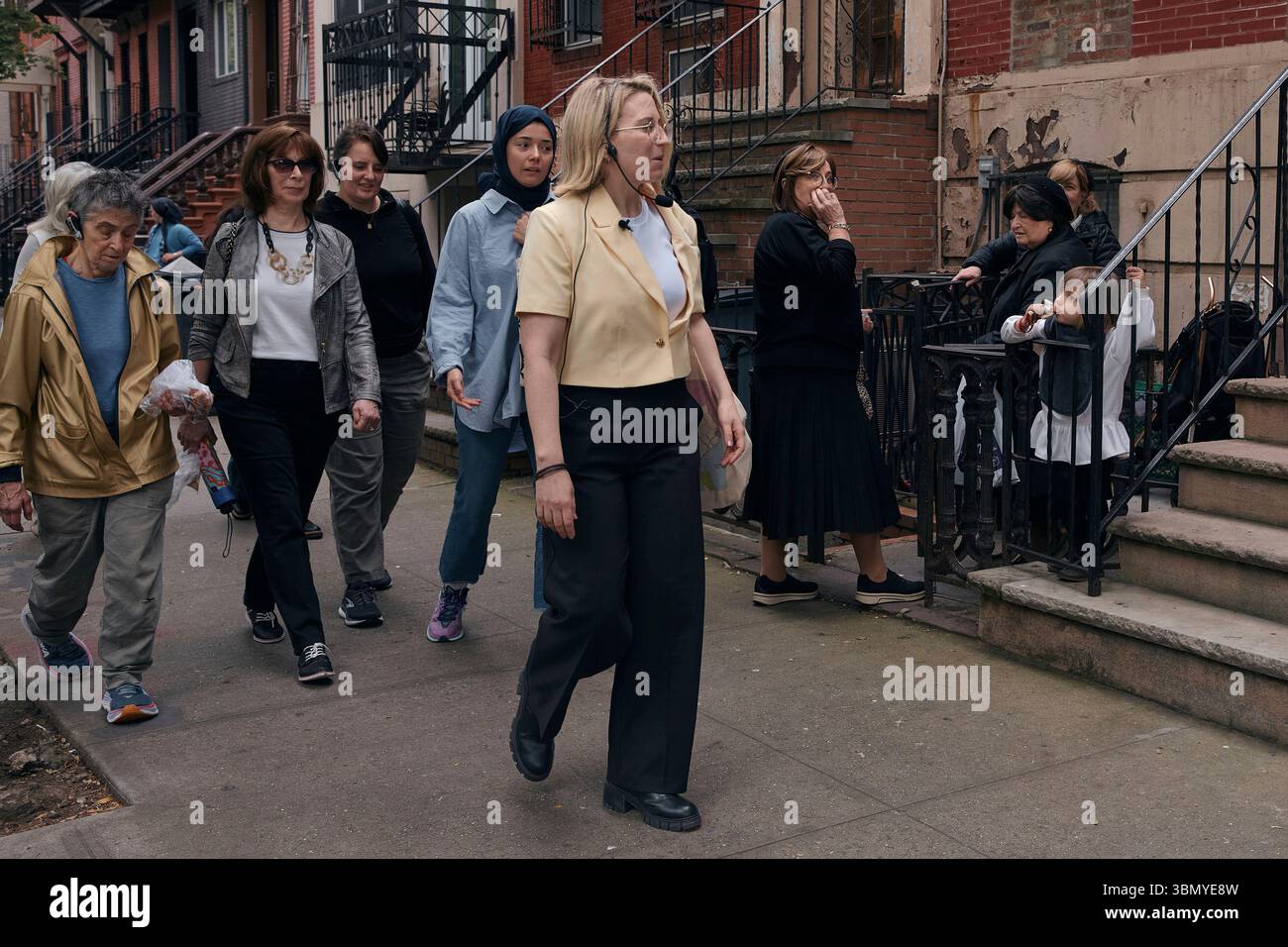 Frieda Vizel, center, guides participants, left, in her walking tour ...