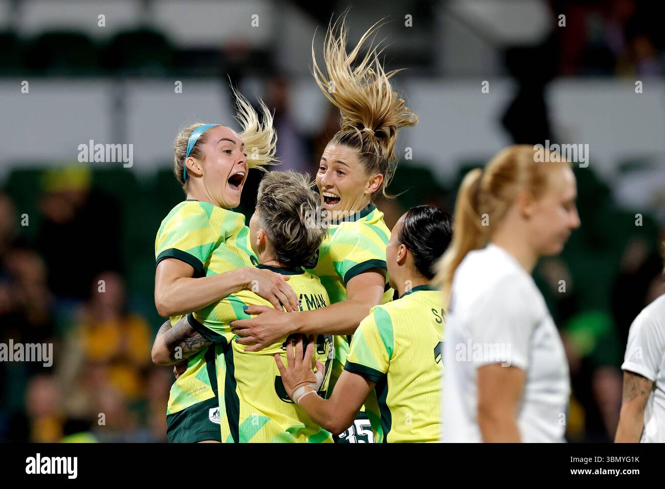 Michelle Heyman of Australia is congratulated by Ellie Carpenter and ...