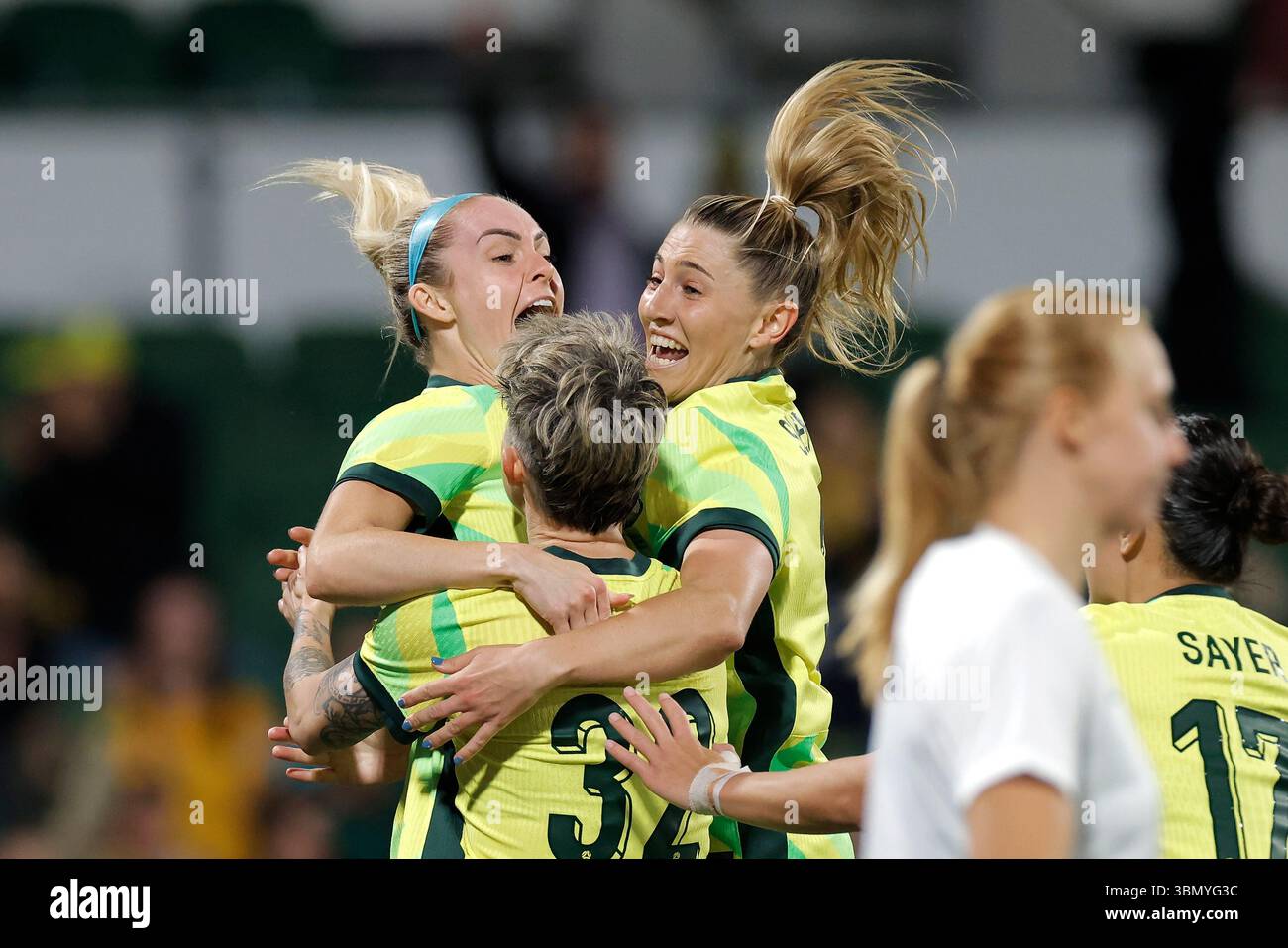 Michelle Heyman of Australia is congratulated by Ellie Carpenter and ...