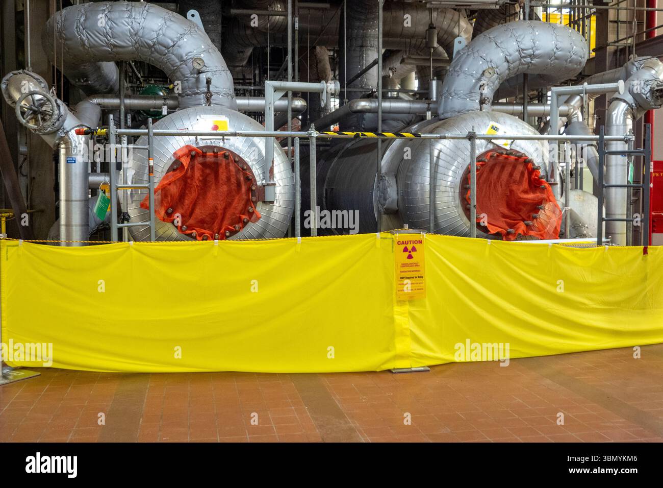 A Caution Radioactive Materials sign is in the pumps and motors level ...
