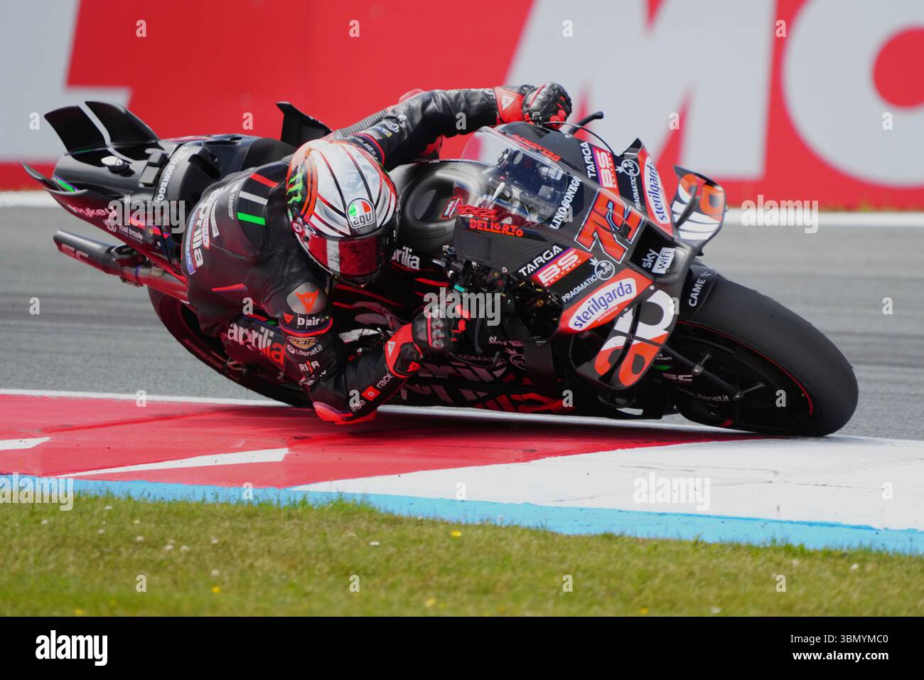 Italian rider Marco Bezzecchi of the Aprilia Racing steers his ...
