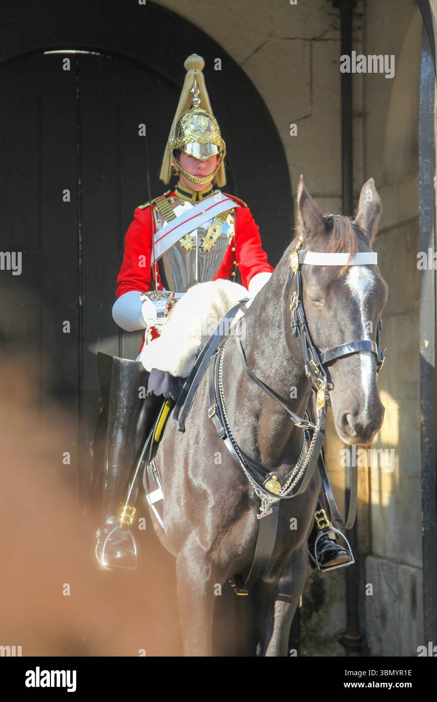 Mounted King’s Guard in ceremonial red uniform and gold helmet at Horse ...