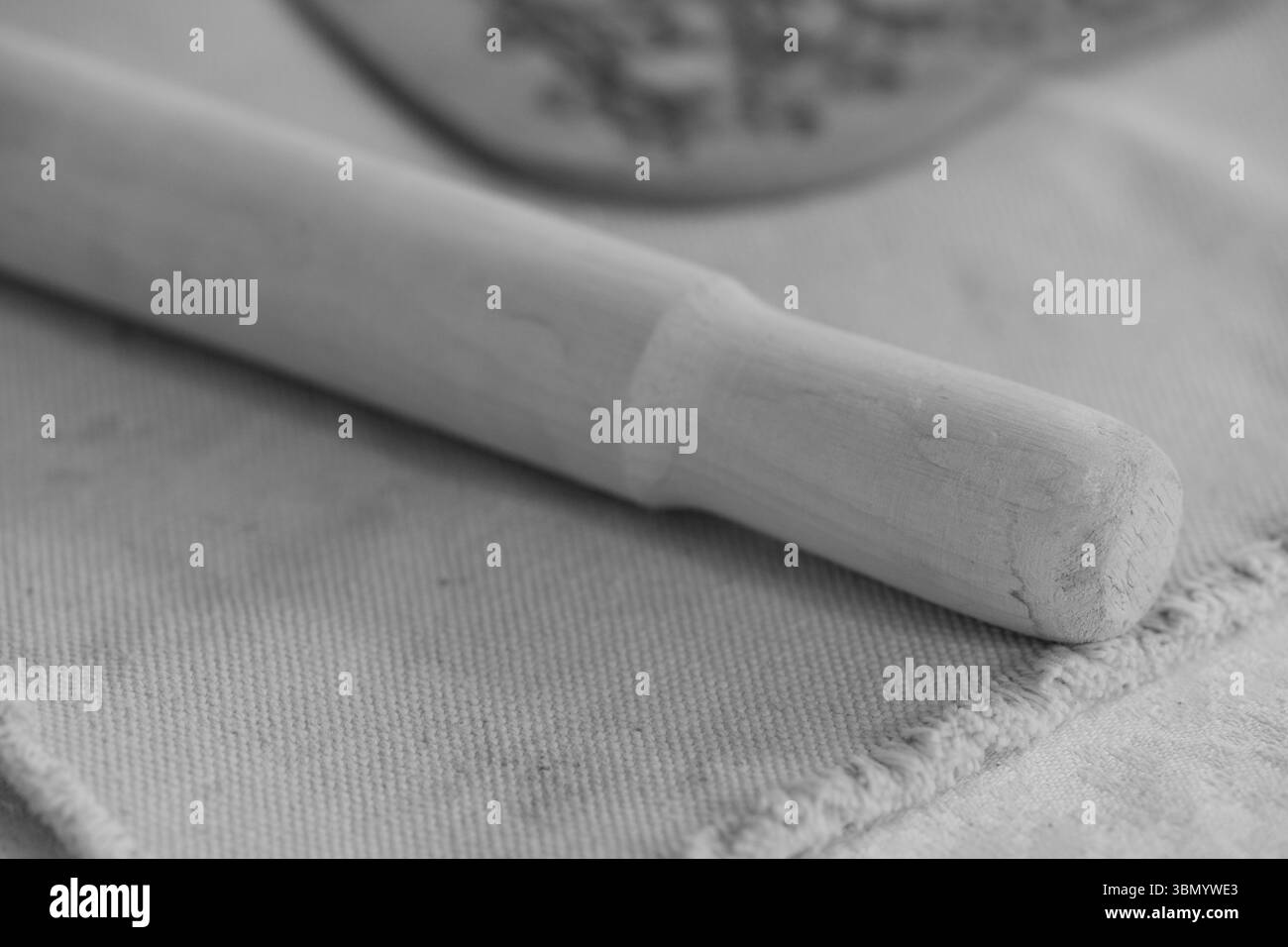 Wooden rolling pin on clay lump and canvas in ceramic workshop for ...