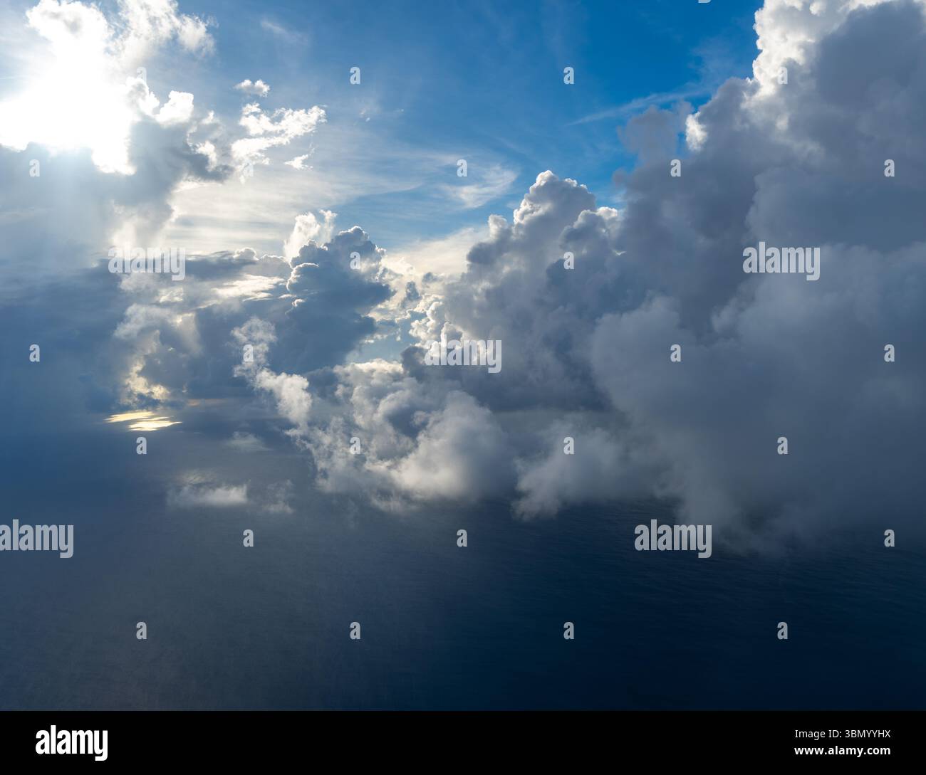 Majestic clouds illuminated by the sun create a dramatic sky viewed ...