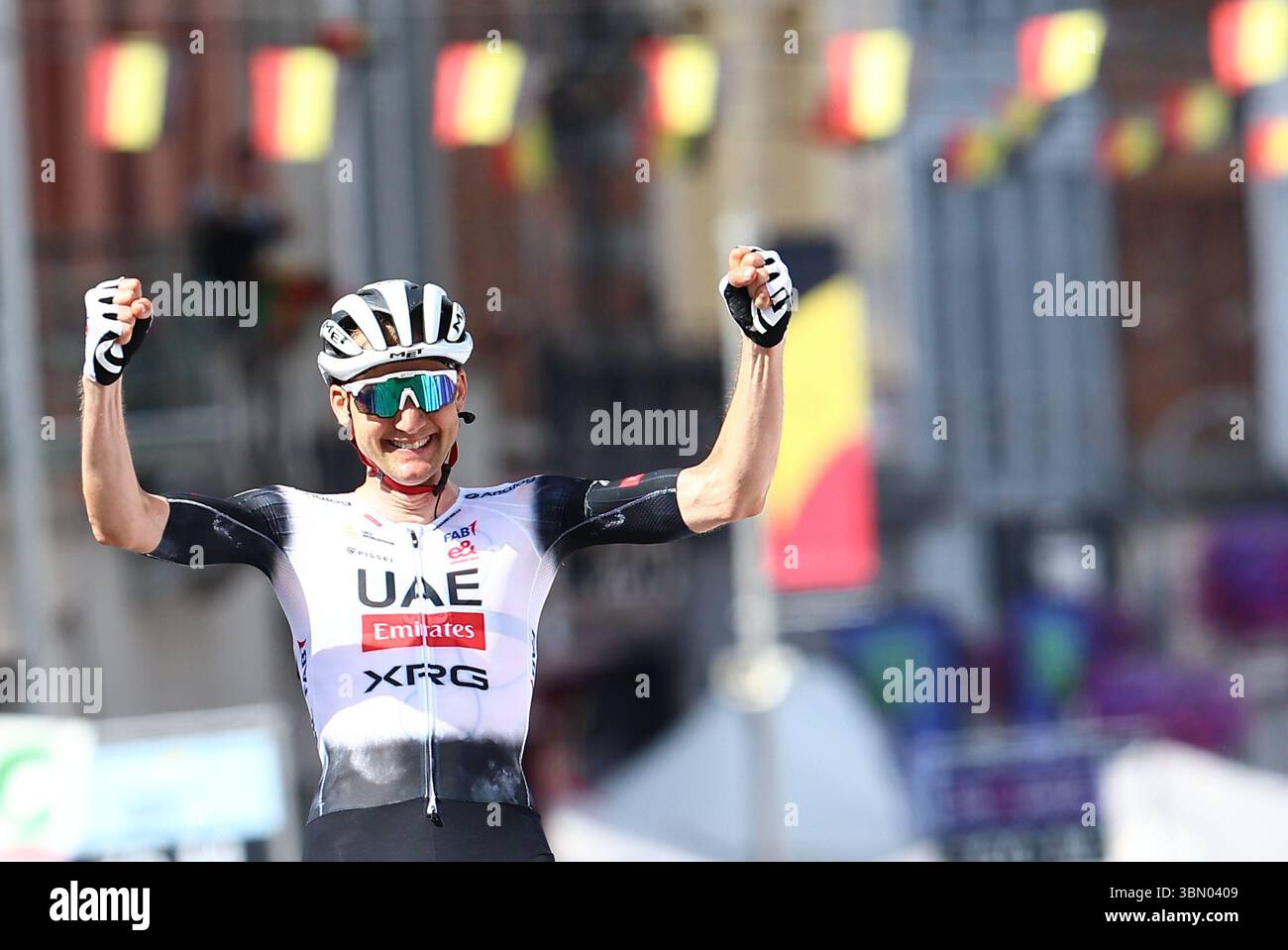 Belgian Tim Wellens of UAE Team Emirates celebrates as he wins the men ...