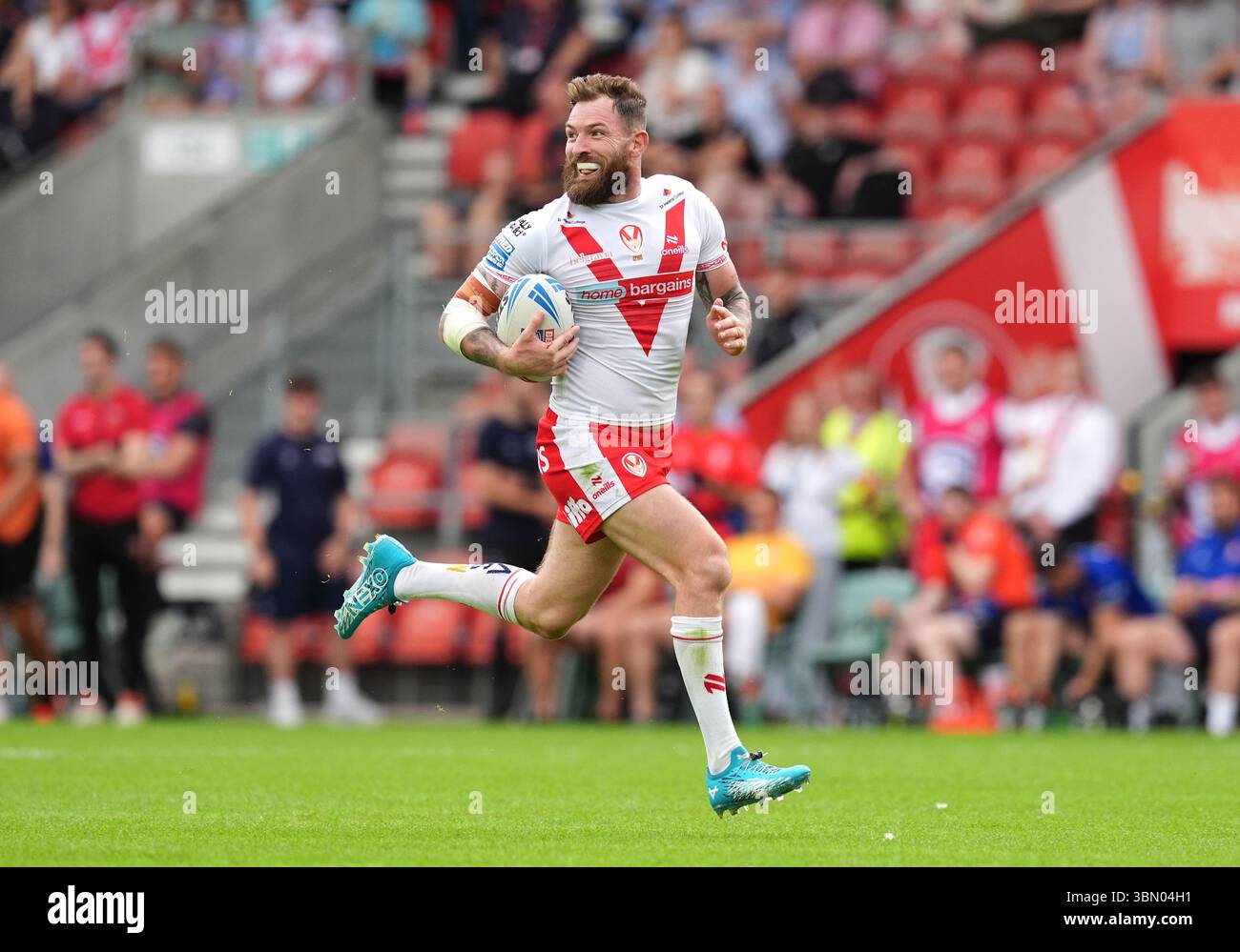 St Helen's Daryl Clark breaks away to score their fifth try during the ...