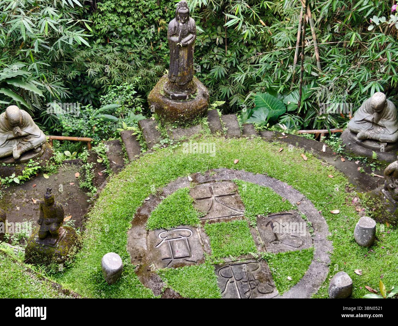 A sacred spiritual circle surrounded by Buddhist monk stone statues and ...