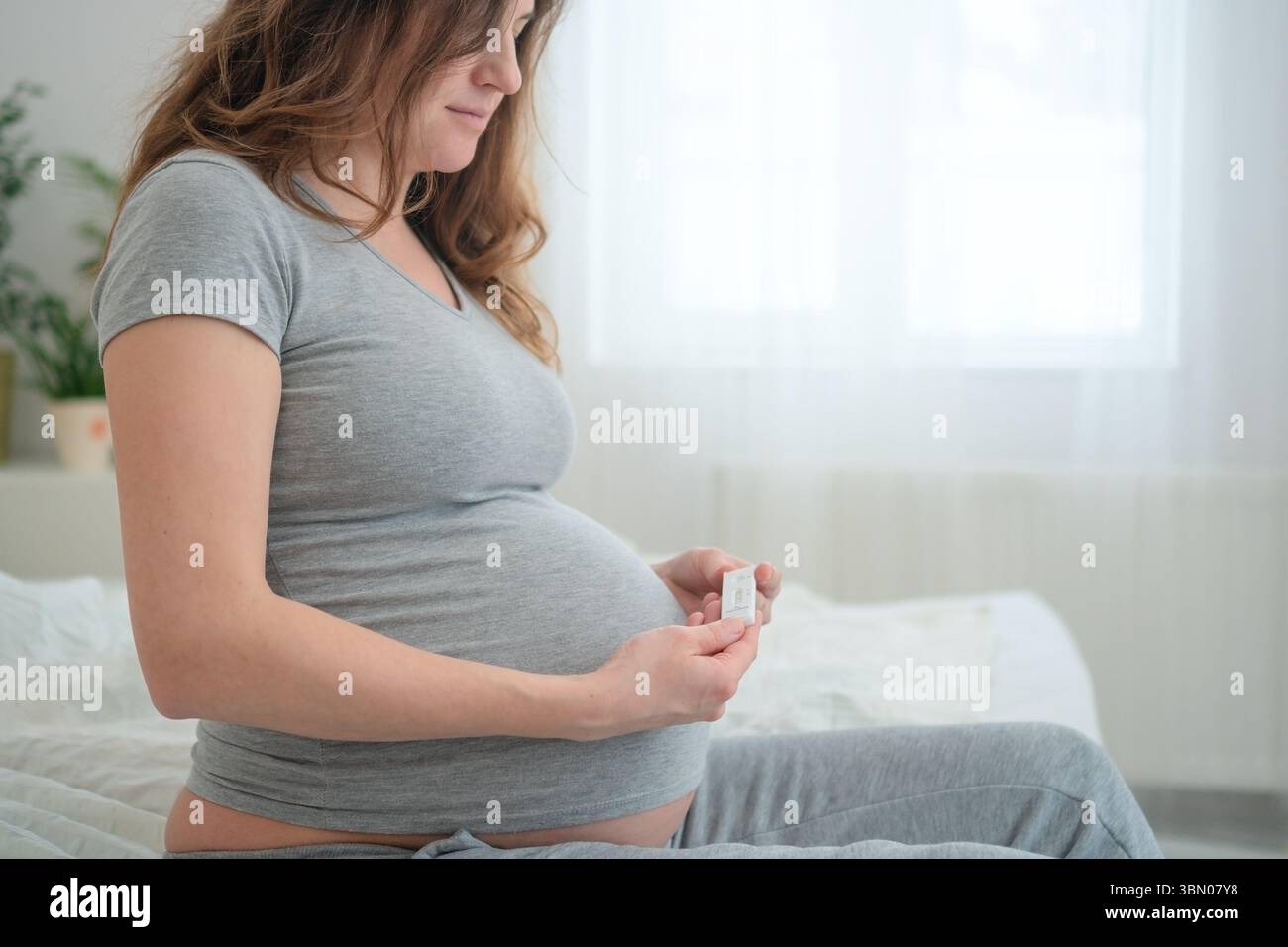 Expecting mother nervously viewing polymerase chain reaction results ...