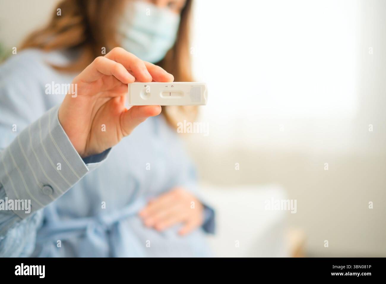 Expecting mother analyzing molecular diagnostic test outcome. Important ...
