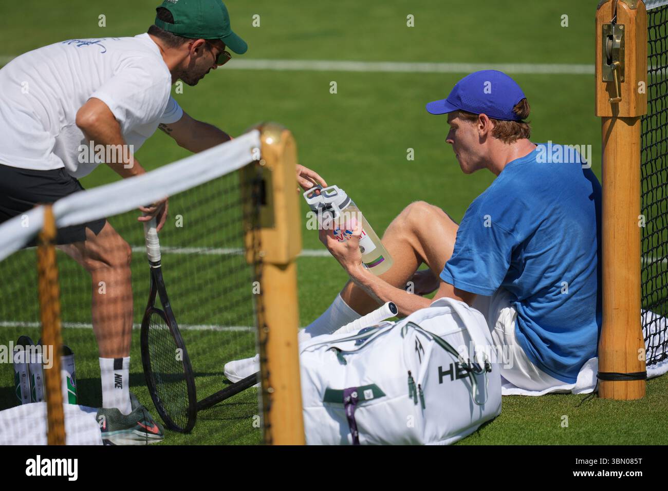 Jannik Sinner of Italy takes a break during a practice session ahead of ...