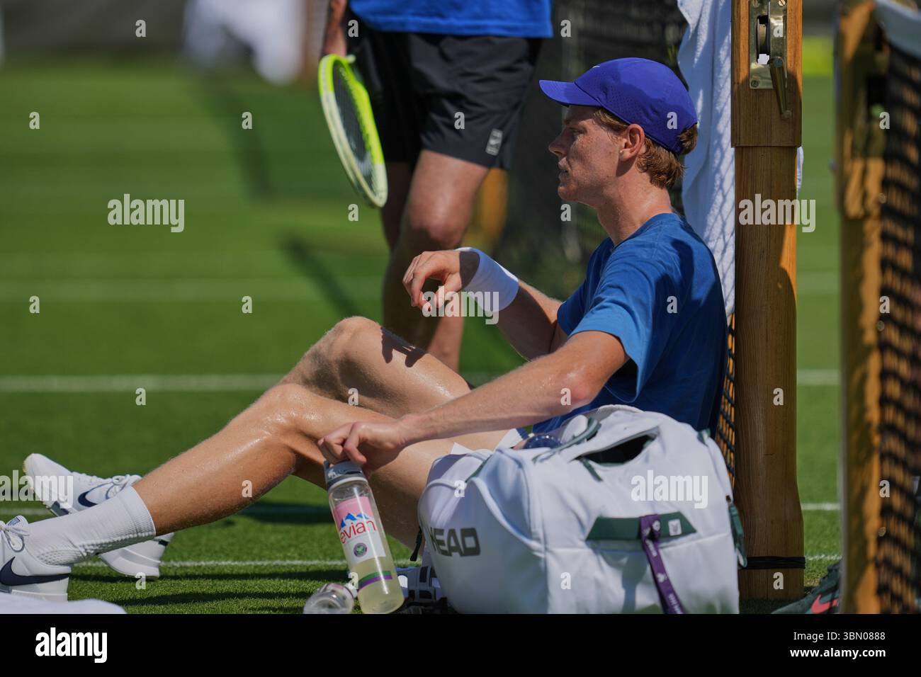Jannik Sinner of Italy takes a break during a practice session ahead of ...
