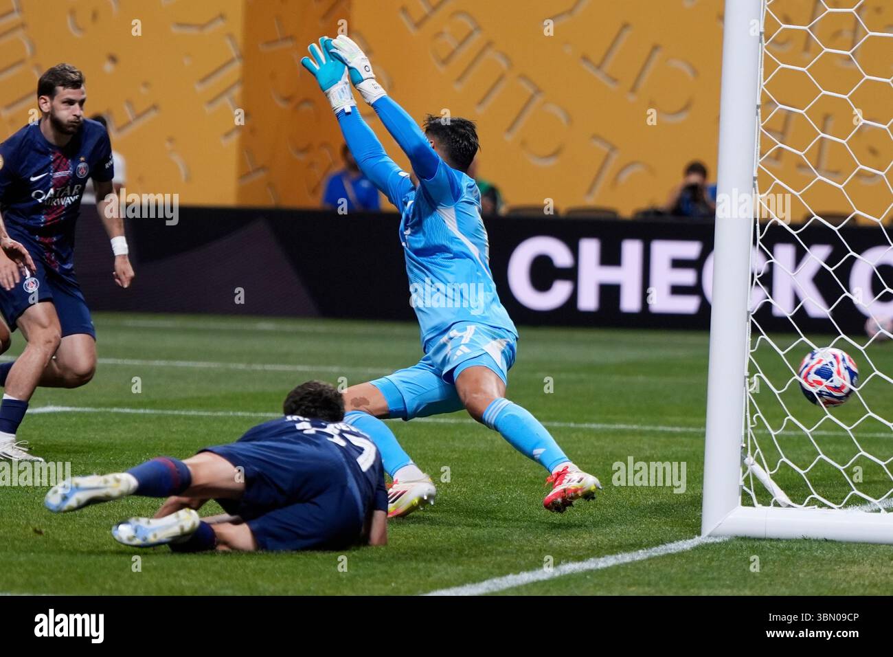 Paris Saint-Germain's Joao Neves, bottom, scores his team's opening goal during the Club World ...