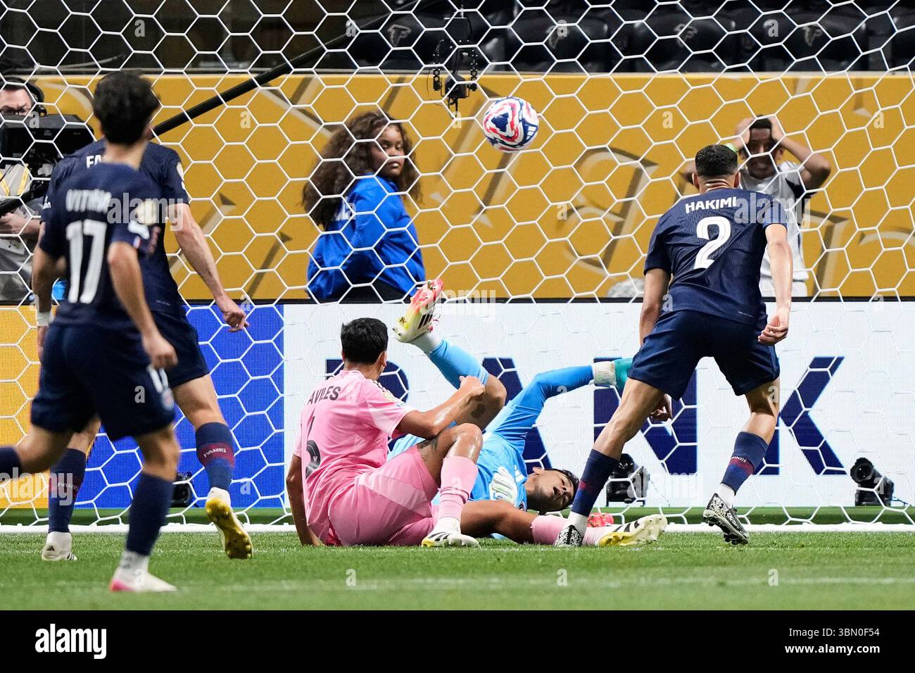Paris Saint-Germain's Achraf Hakimi, right, scores his side's fourth ...