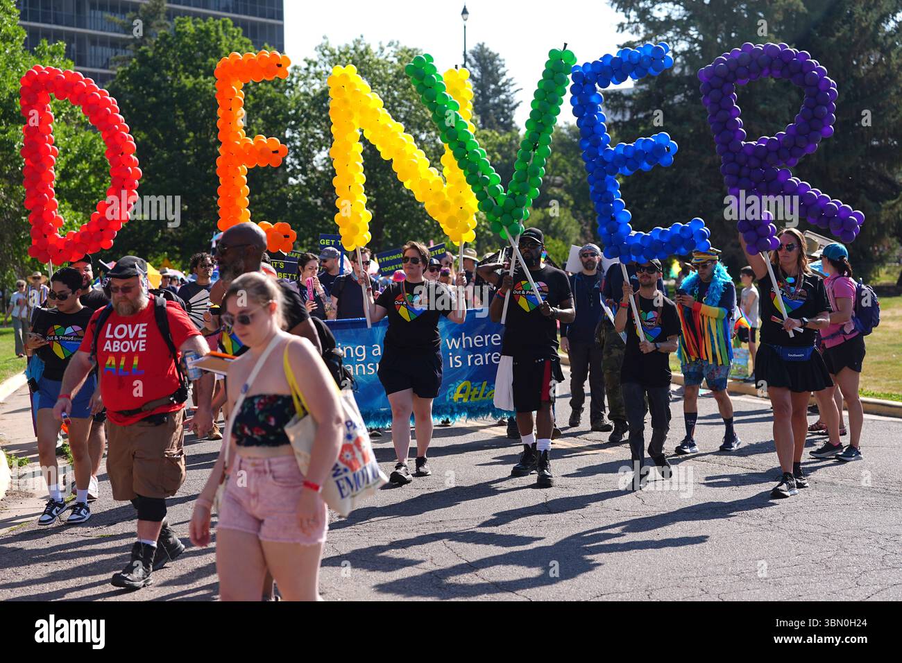 Participants head out of Cheesman Park to take part in a parade to mark ...